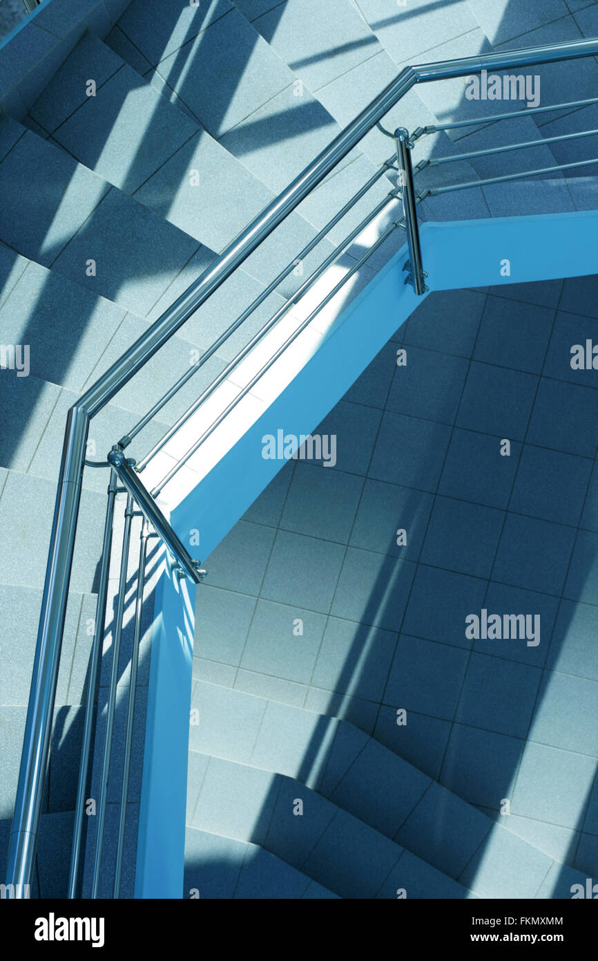 Modern staircase between floors with a metal handrail Stock Photo - Alamy
