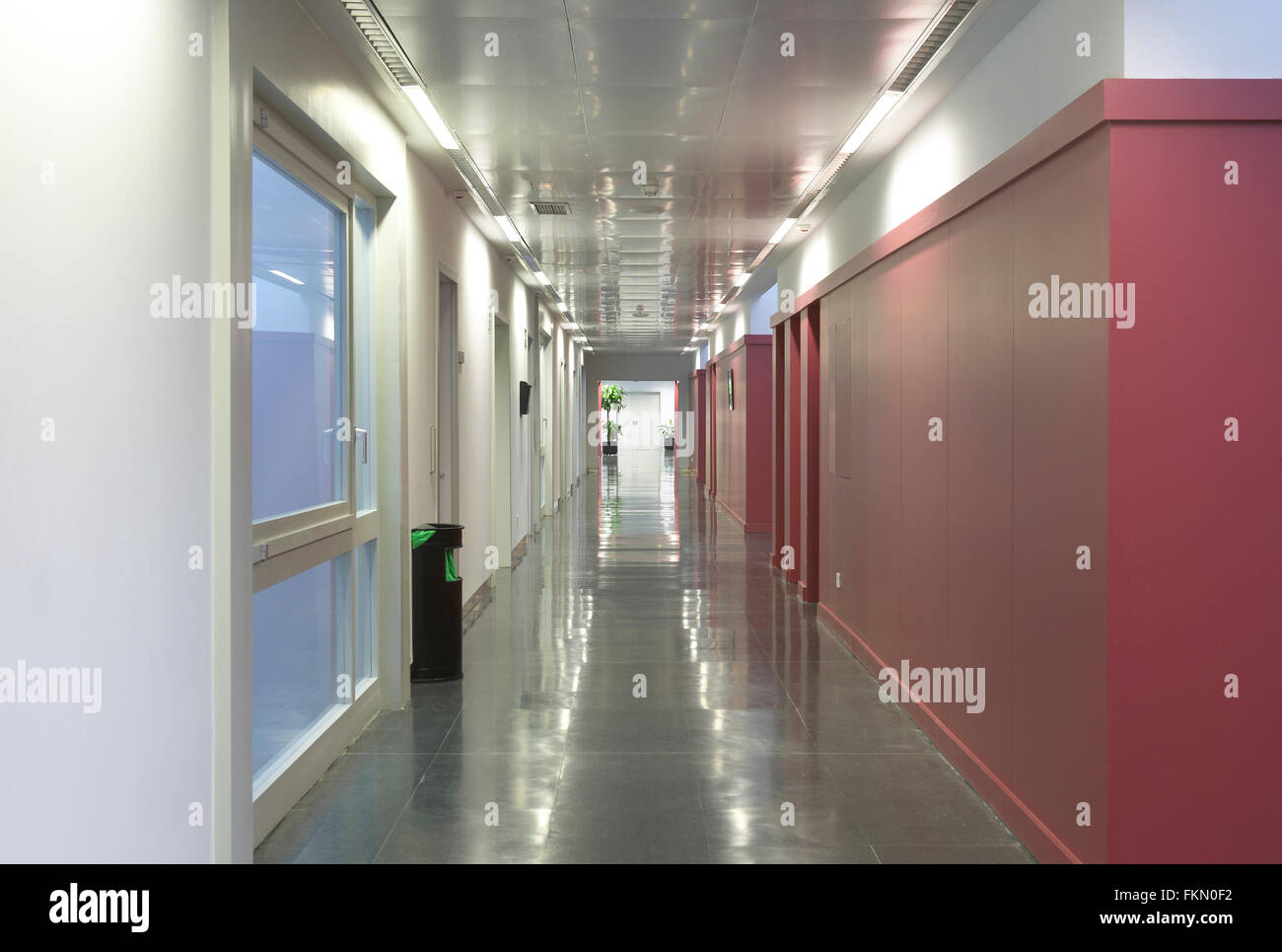 Modern building corridor with red wall. Horizontal format Stock Photo ...