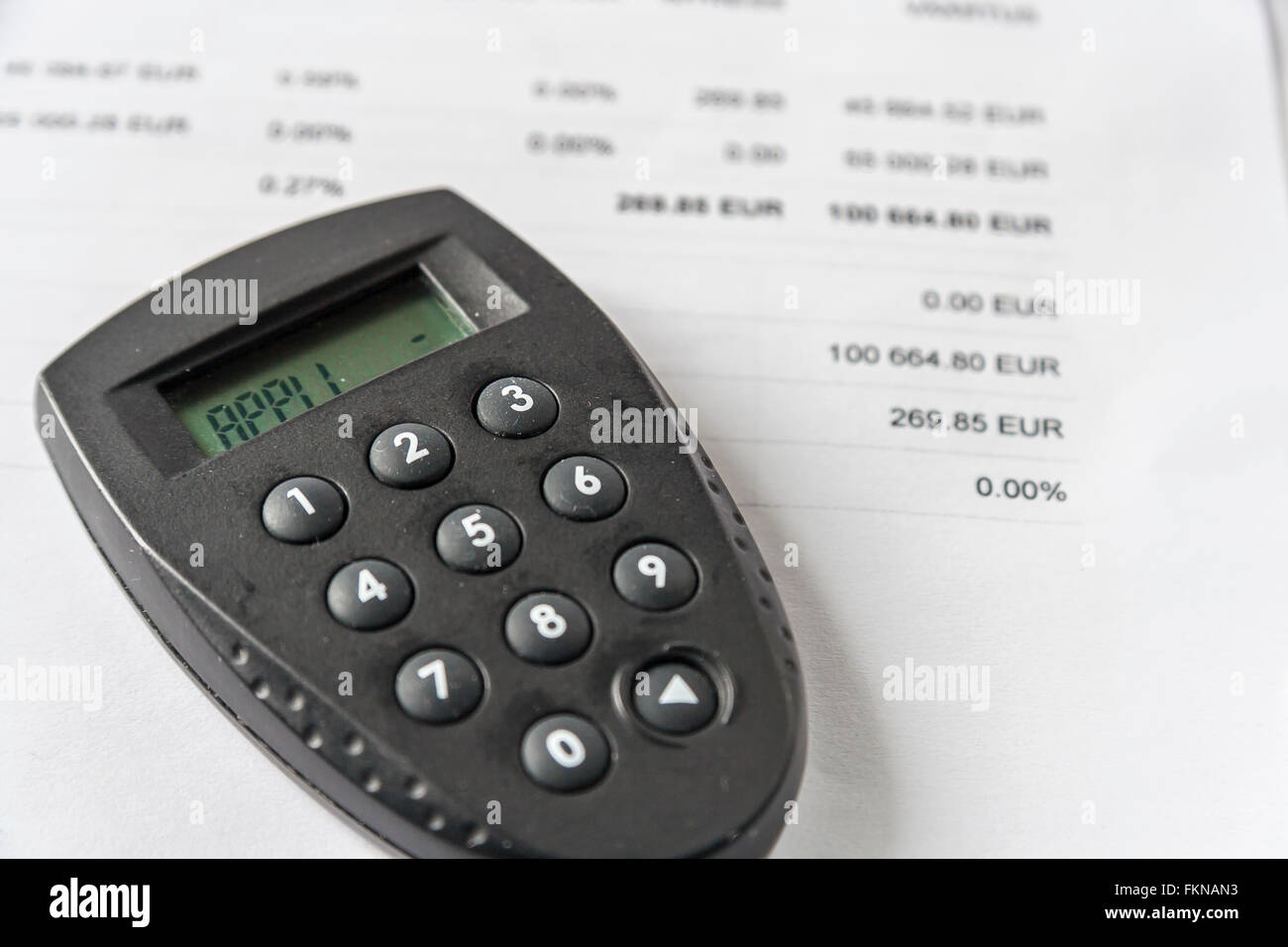PIN Code Calculator On Financial Document Stock Photo - Alamy