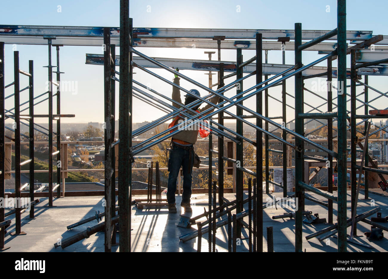 Worker installing scaffoldings Stock Photo - Alamy