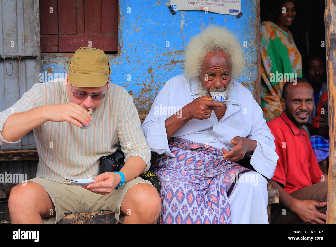 DEGAN, ETHIOPIA-MARCH 25: Local VIP shares a cup of coffee with a ...