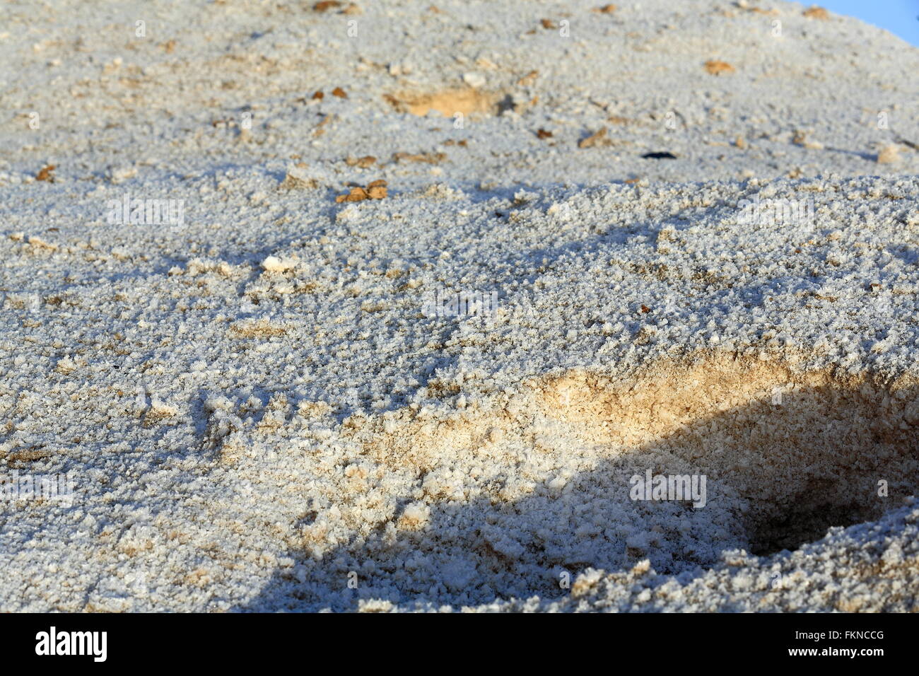 Salt in the salt works by water evaporation-salt mounds beside the W ...