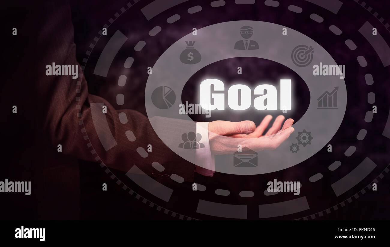 Businessman pressing an Goal concept button Stock Photo - Alamy