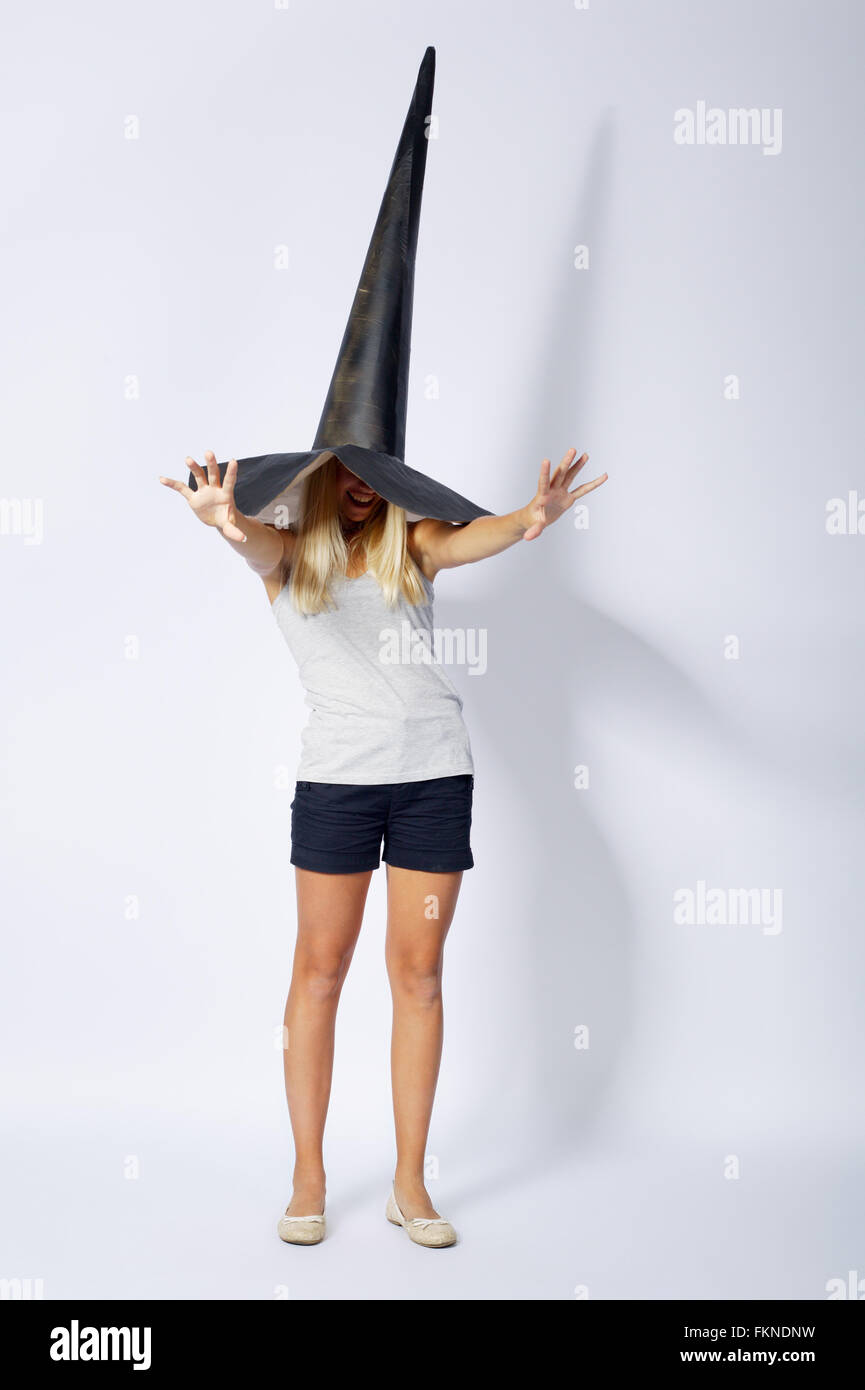 beautiful girl with funny wizard hat Stock Photo - Alamy