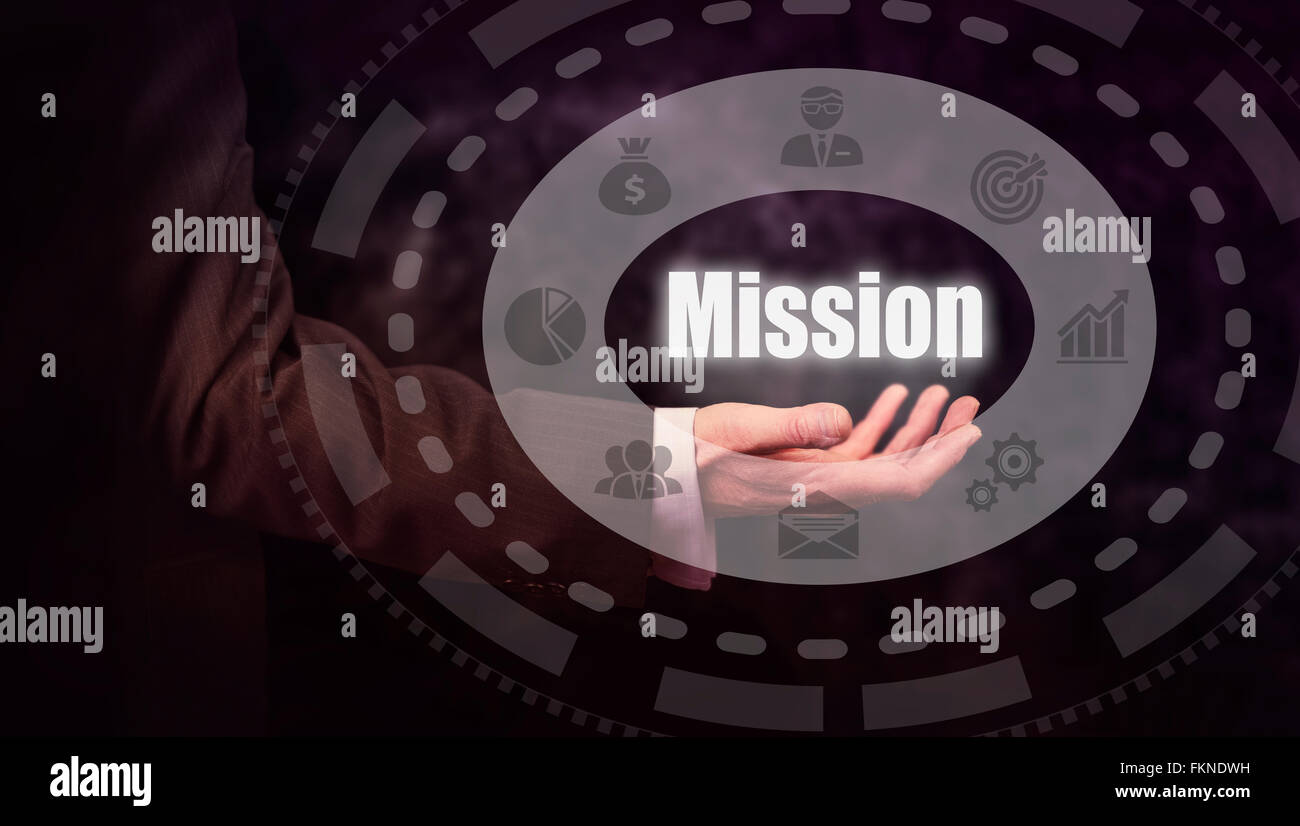 Businessman pressing a Mission concept button Stock Photo - Alamy