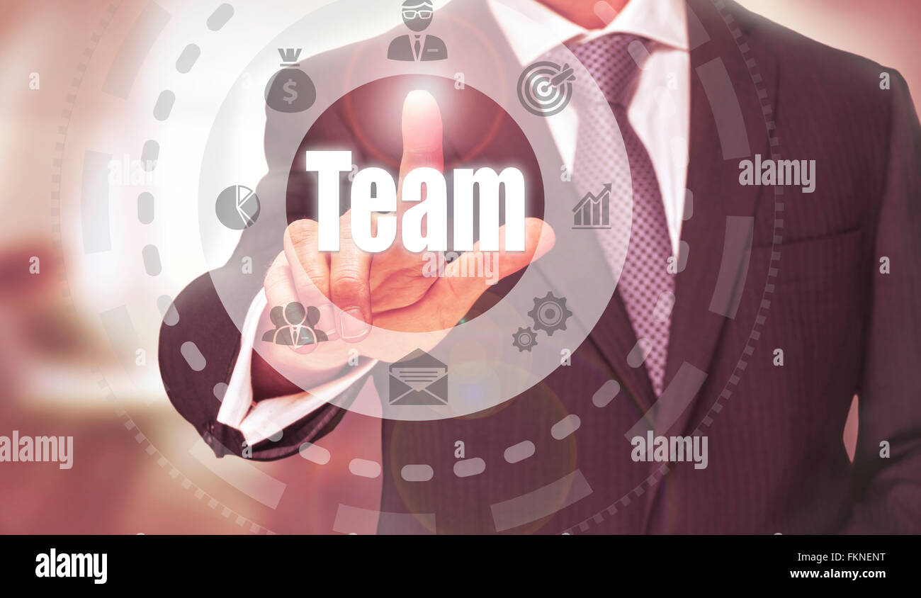 Businessman pressing an Team concept button Stock Photo - Alamy