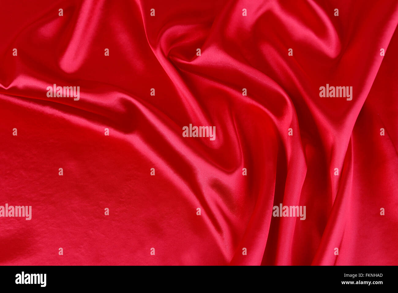 Closeup of ripples in red silk fabric Stock Photo - Alamy