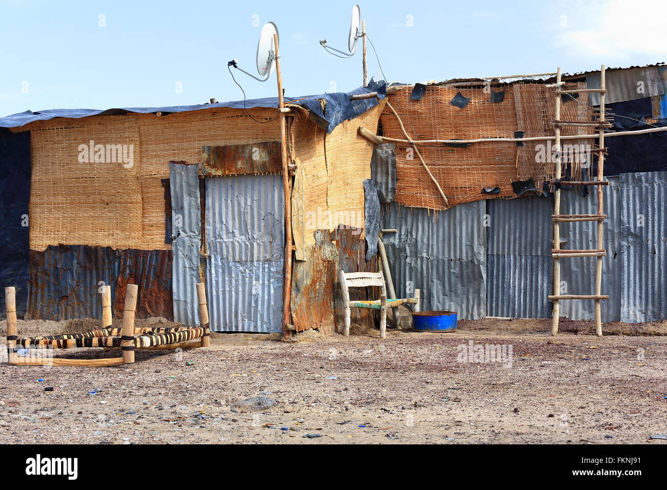 Local hut made out of hurdle-woven straw and corrugated sheet with ...