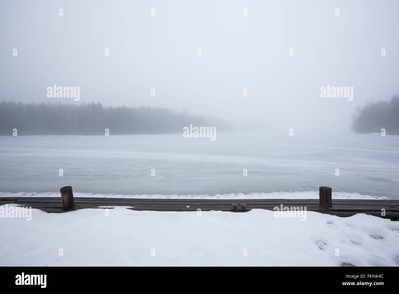 Thick fog at frozen lake landscape Stock Photo - Alamy