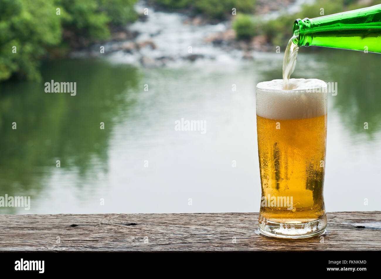Beer pouring Stock Photo - Alamy