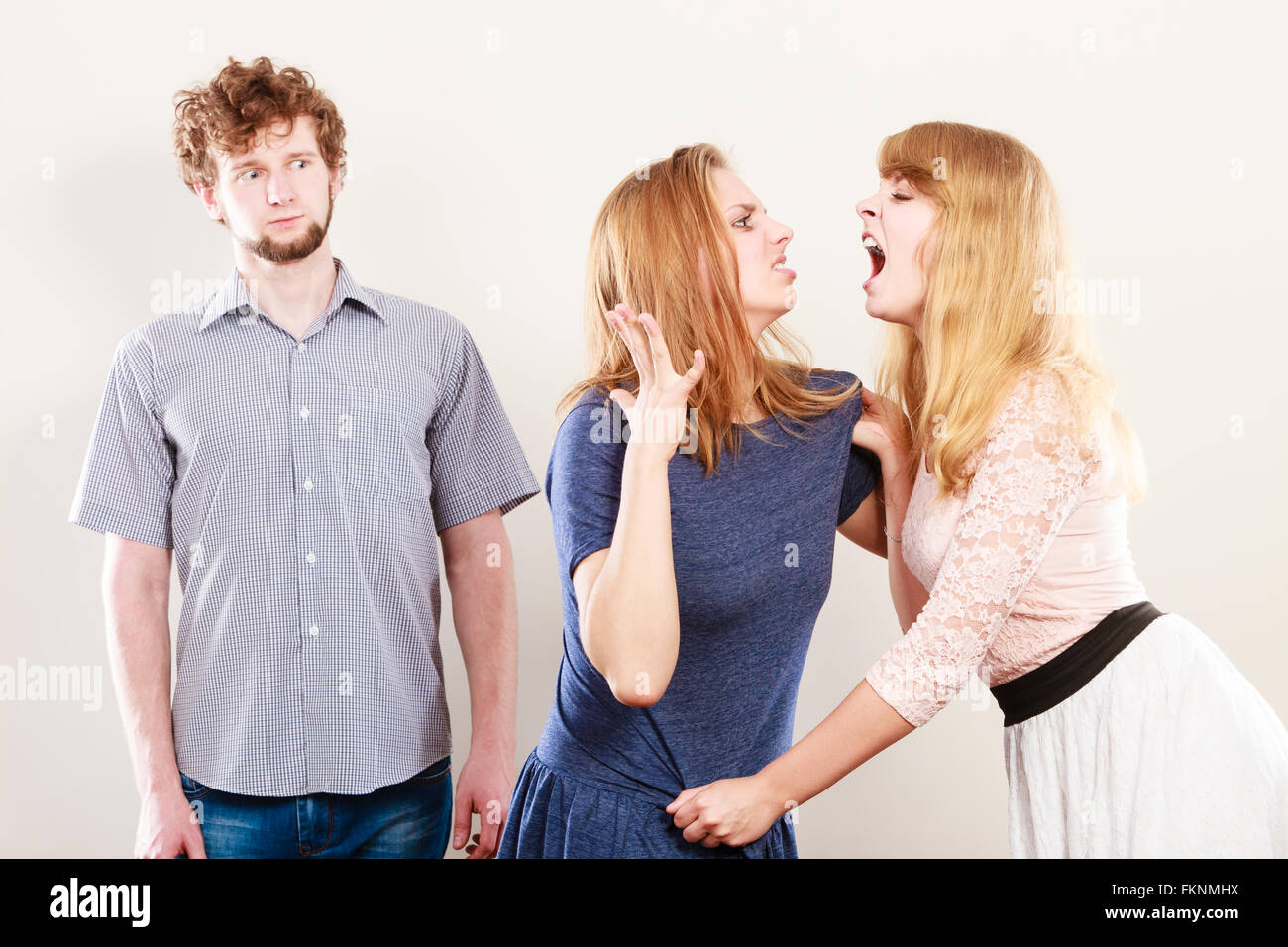 Man women jealous fight over hi-res stock photography and images - Alamy