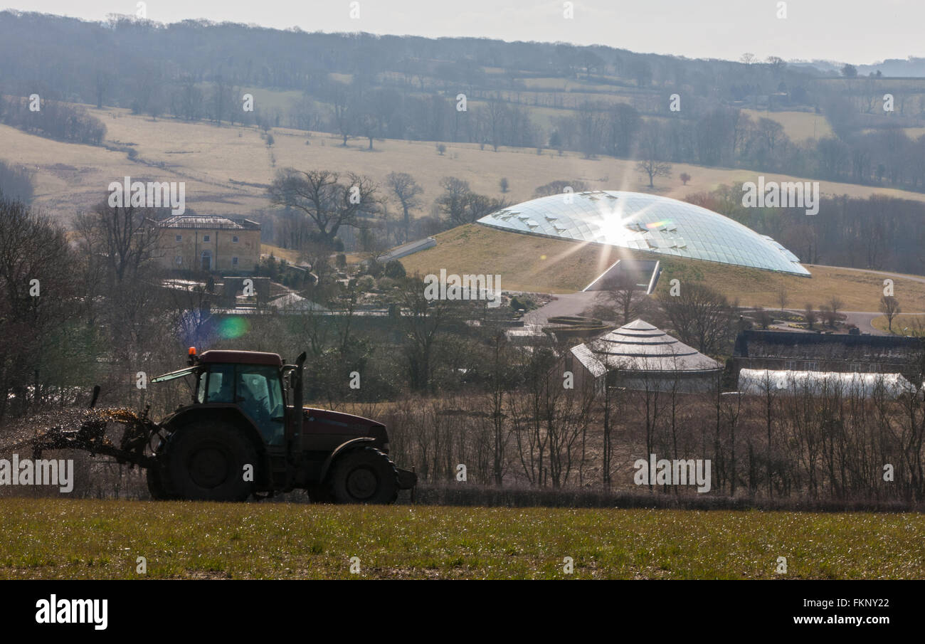 Tractor putting,spraying manure,muck spreading on field and National ...