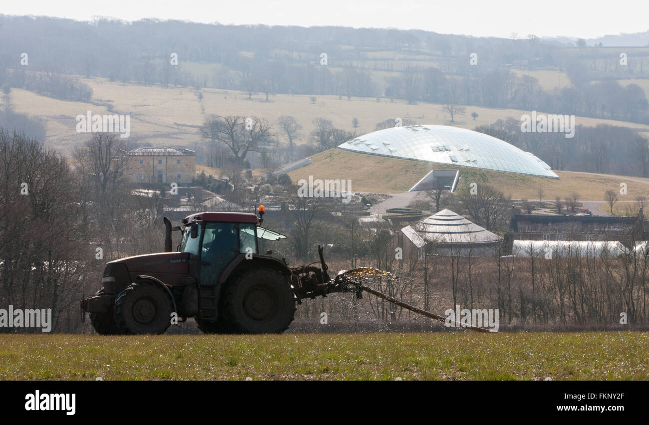 Tractor putting,spraying manure,muck spreading on field and National ...