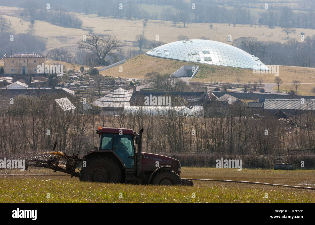 Tractor putting,spraying manure,muck spreading on field and National ...
