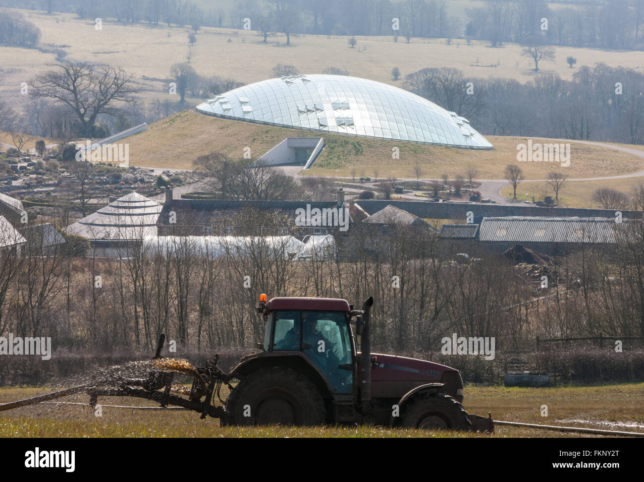 Tractor putting,spraying manure,muck spreading on field and National ...