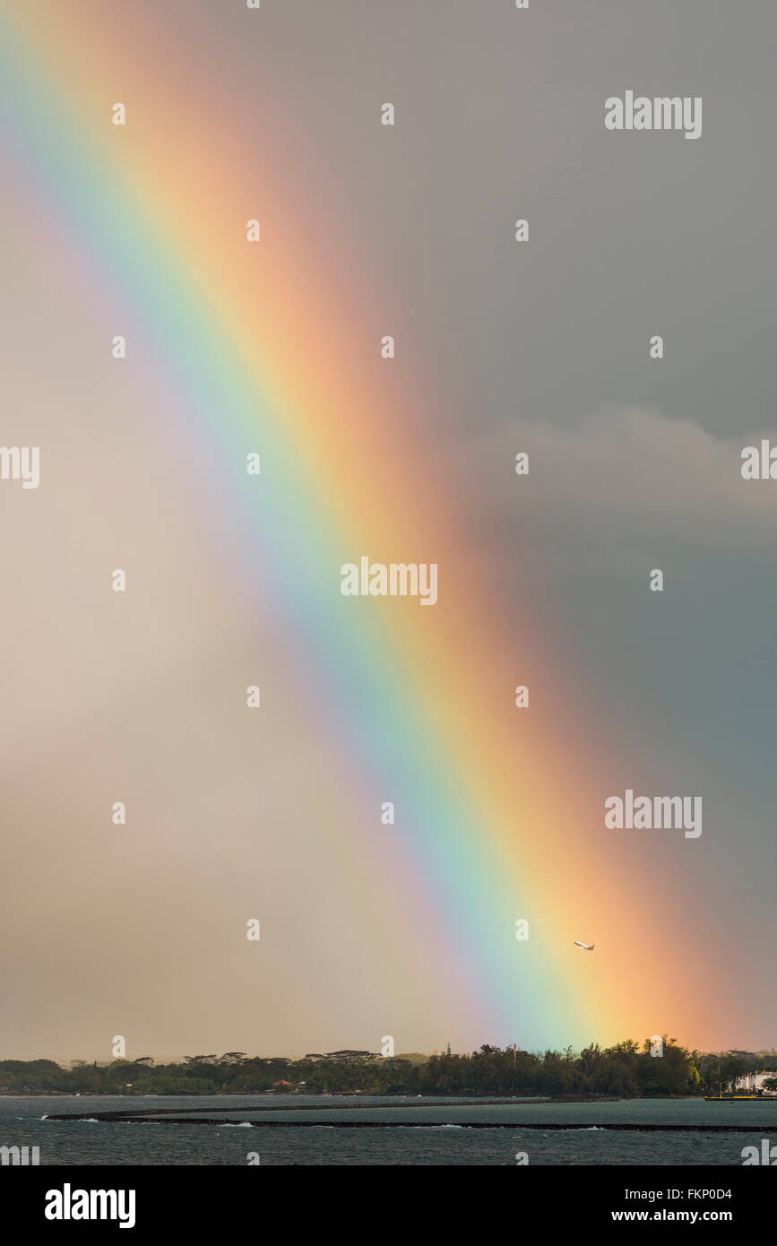 Jet airplane in rainbow while landing at the Hilo International Airport ...