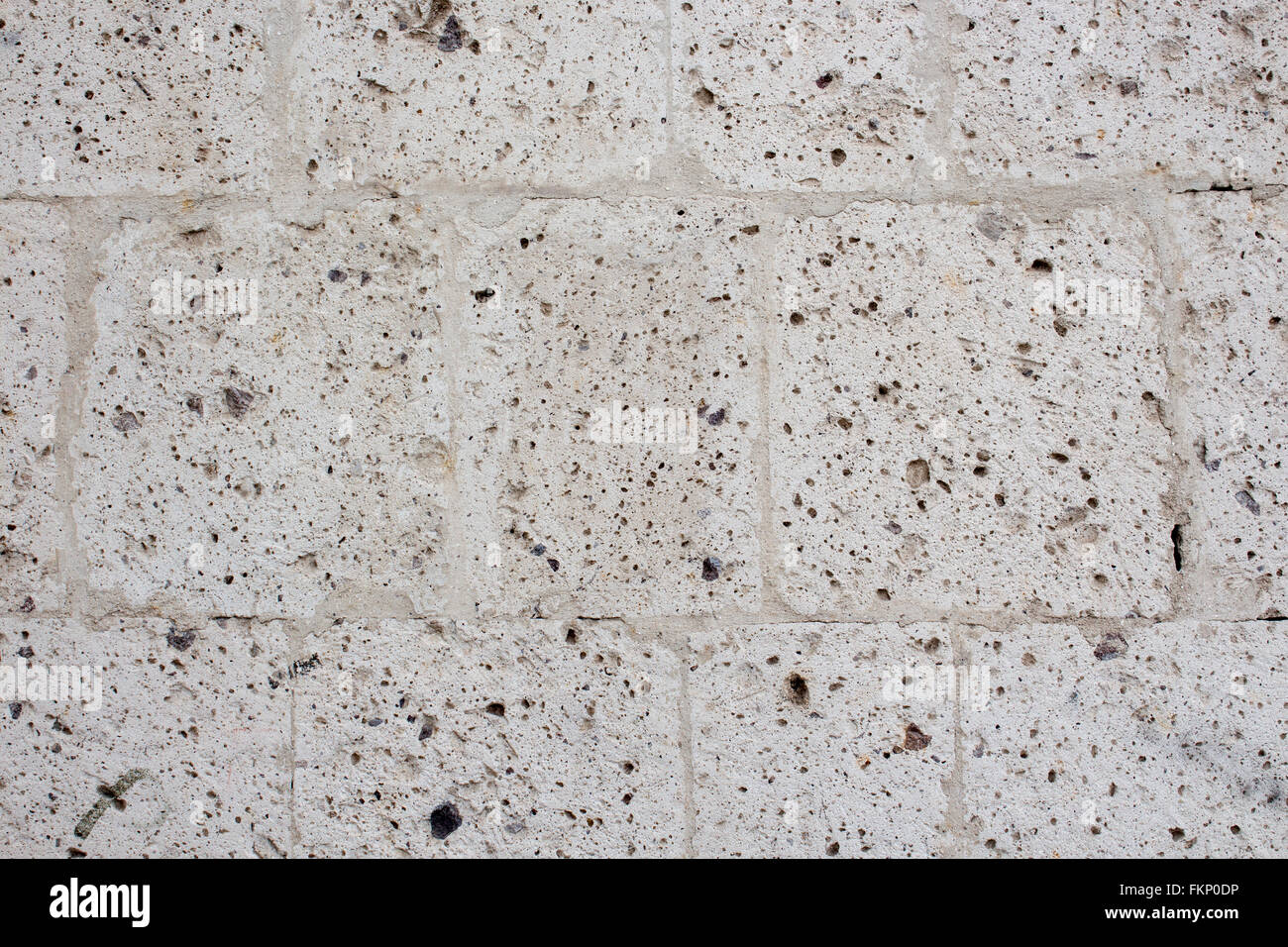 Sillar stone wall, in Arequipa, Peru. Volcanic rock Stock Photo - Alamy