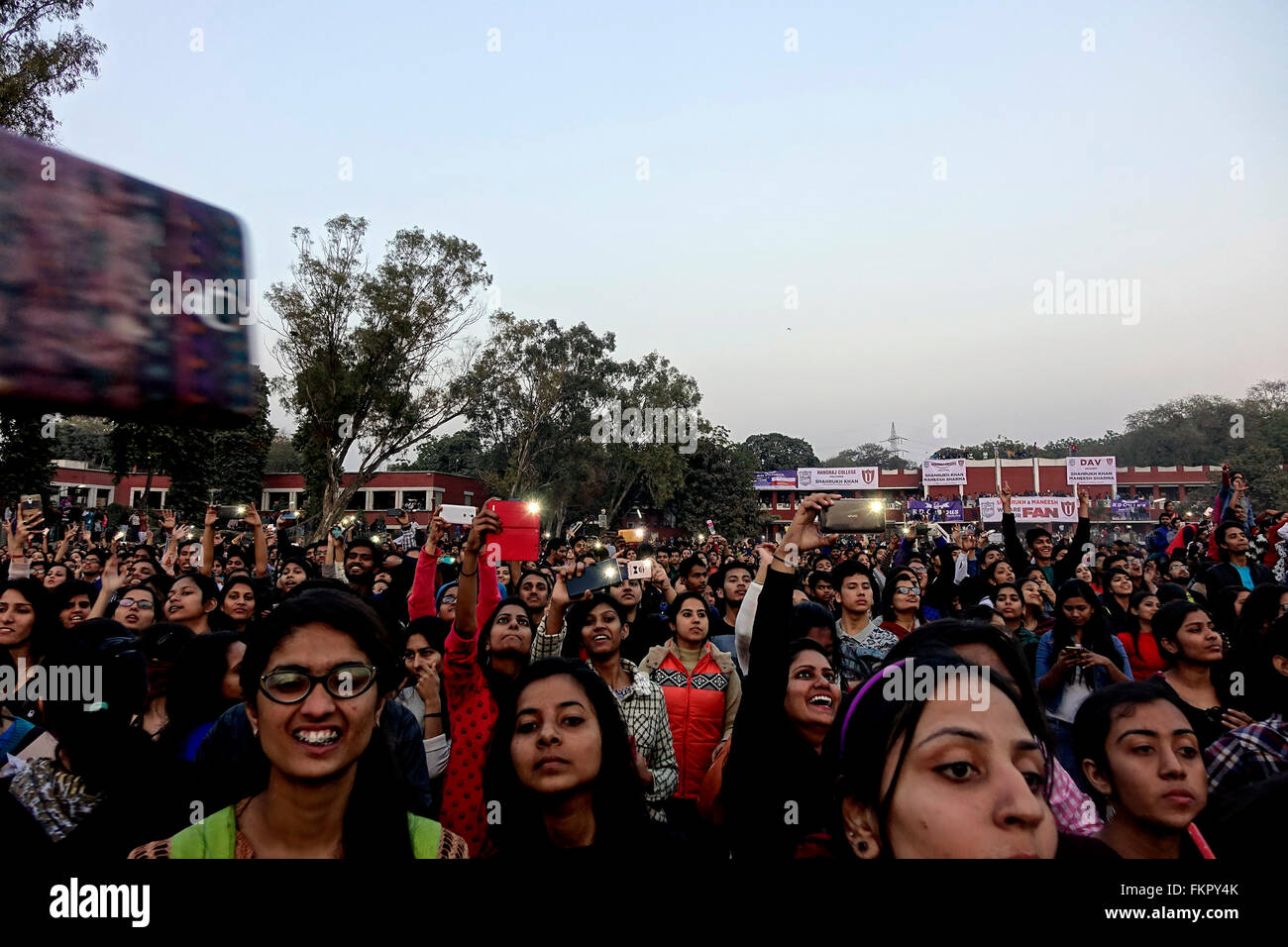 Crowd of students attending an open-air performance in their campus ...