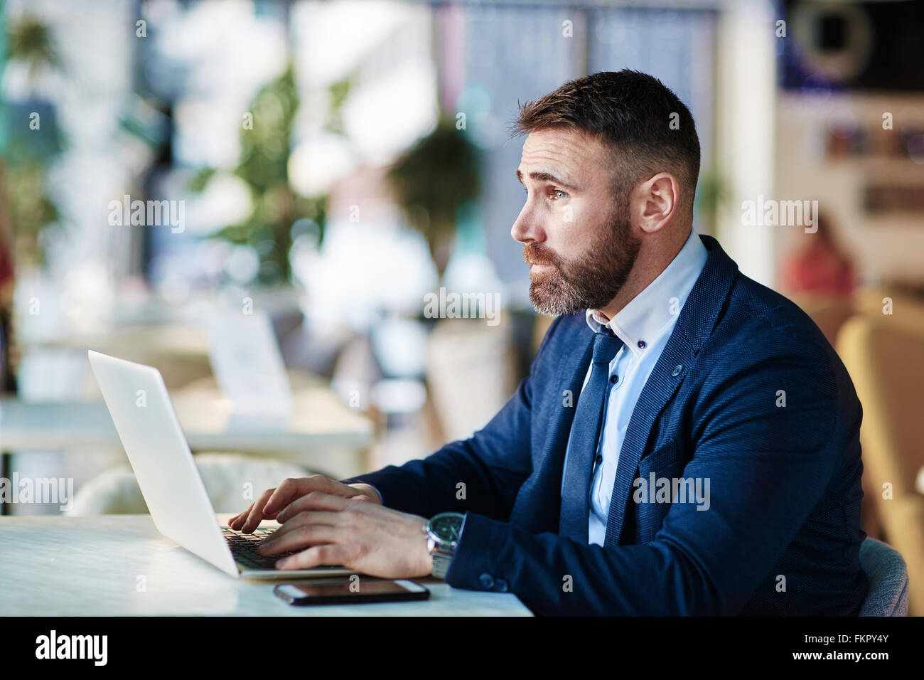 Serious manager busy with work Stock Photo - Alamy
