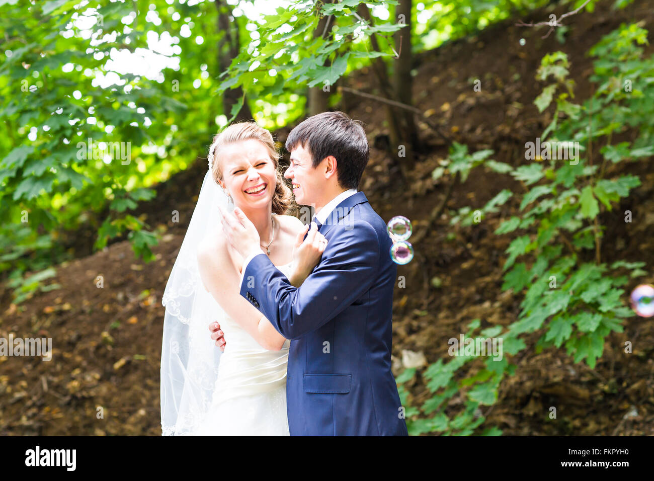 Wedding, Beautiful Romantic Bride and Groom Embracing Stock Photo - Alamy