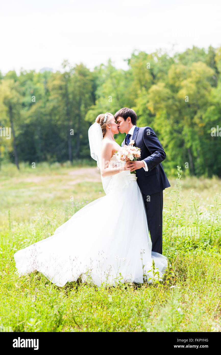 Wedding, Beautiful Romantic Bride and Groom Kissing Stock Photo - Alamy