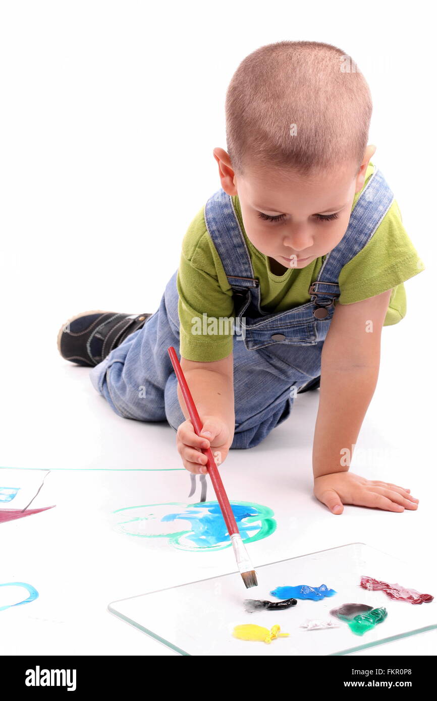 Little boy making drawing Cut Out Stock Images & Pictures - Alamy