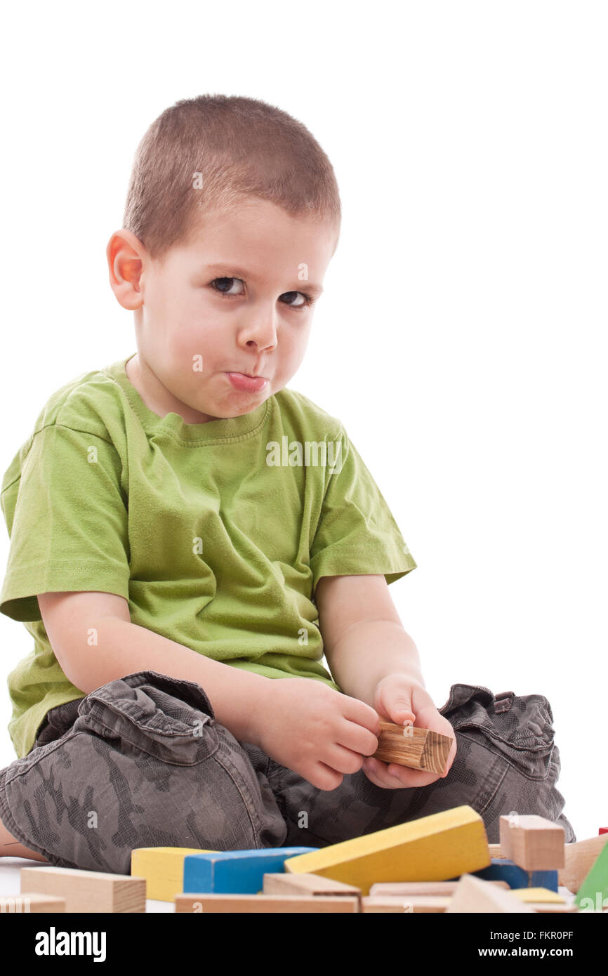 Sad boy whit blocks, isolated on white Stock Photo - Alamy