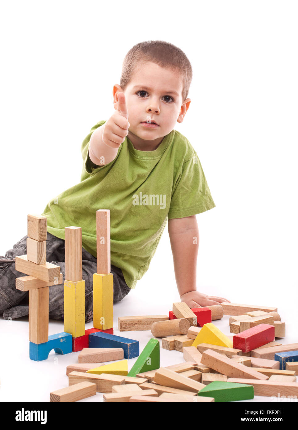little boy playing with colorful blocks and showing ok Stock Photo - Alamy