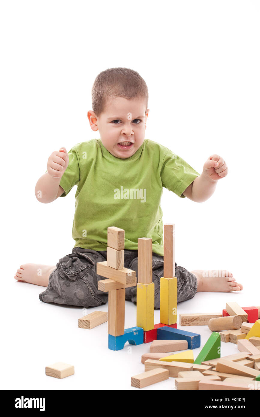 Angry boy whit blocks, isolated on white Stock Photo - Alamy