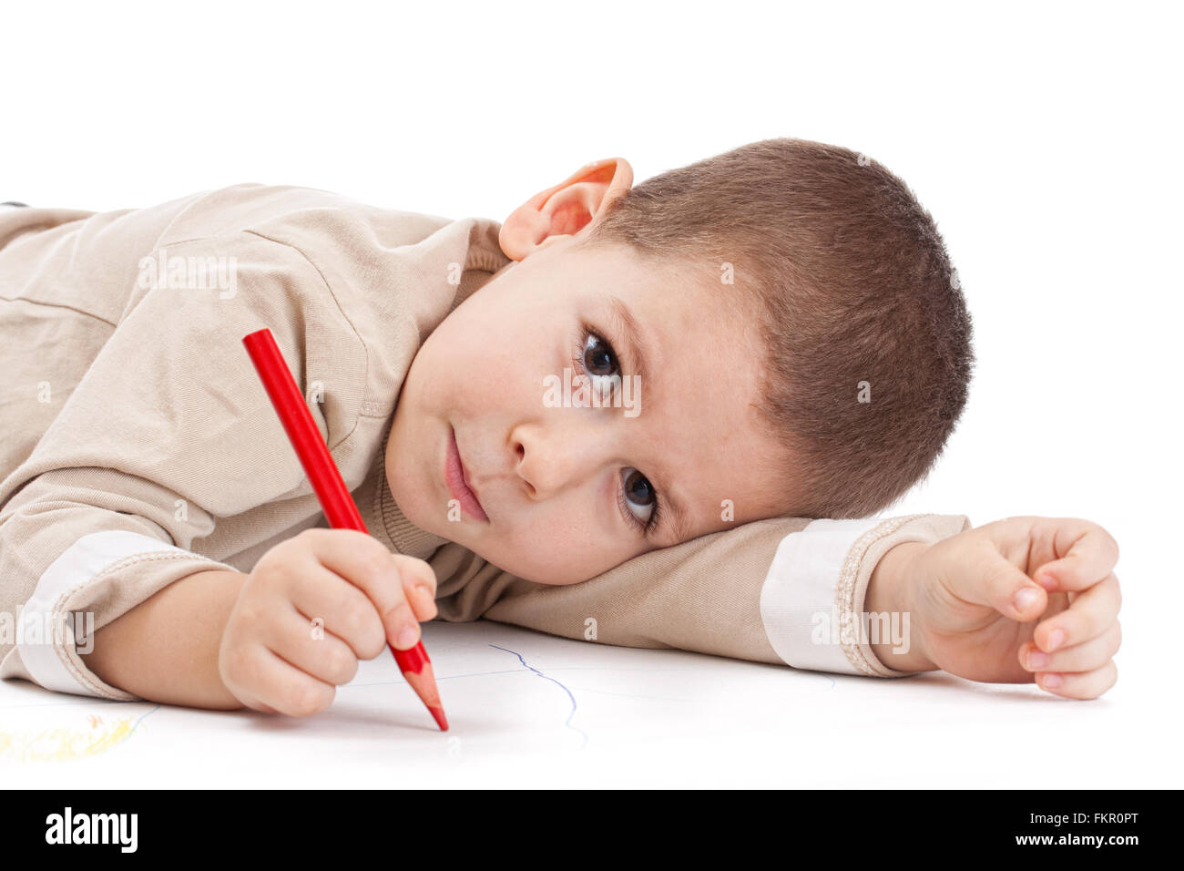 Little boy drawing with red pencil Stock Photo - Alamy