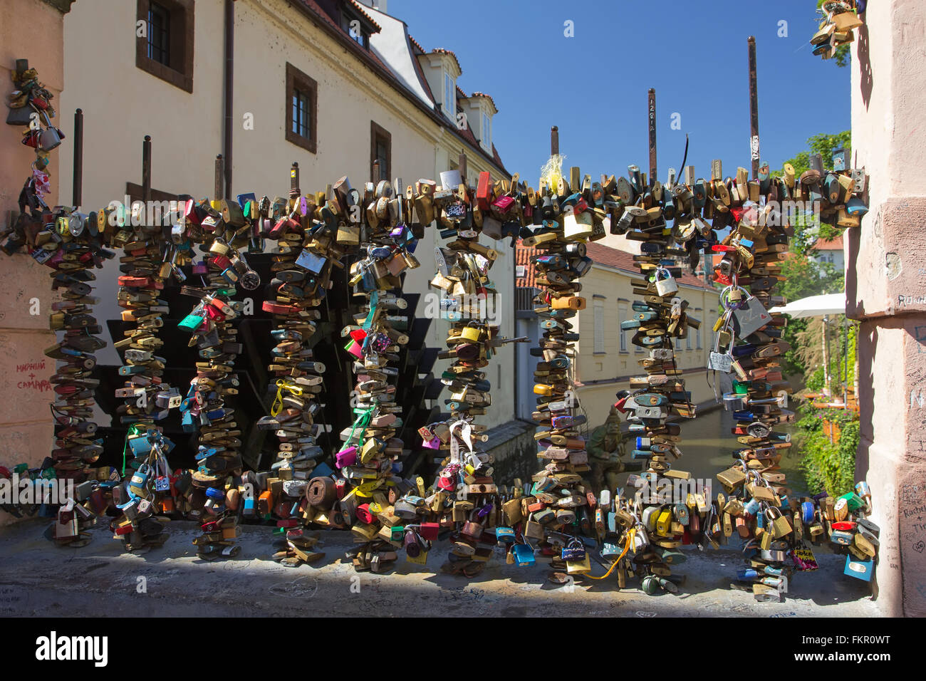 Hundreds of padlocks, locked to railings on a small bridge on ...