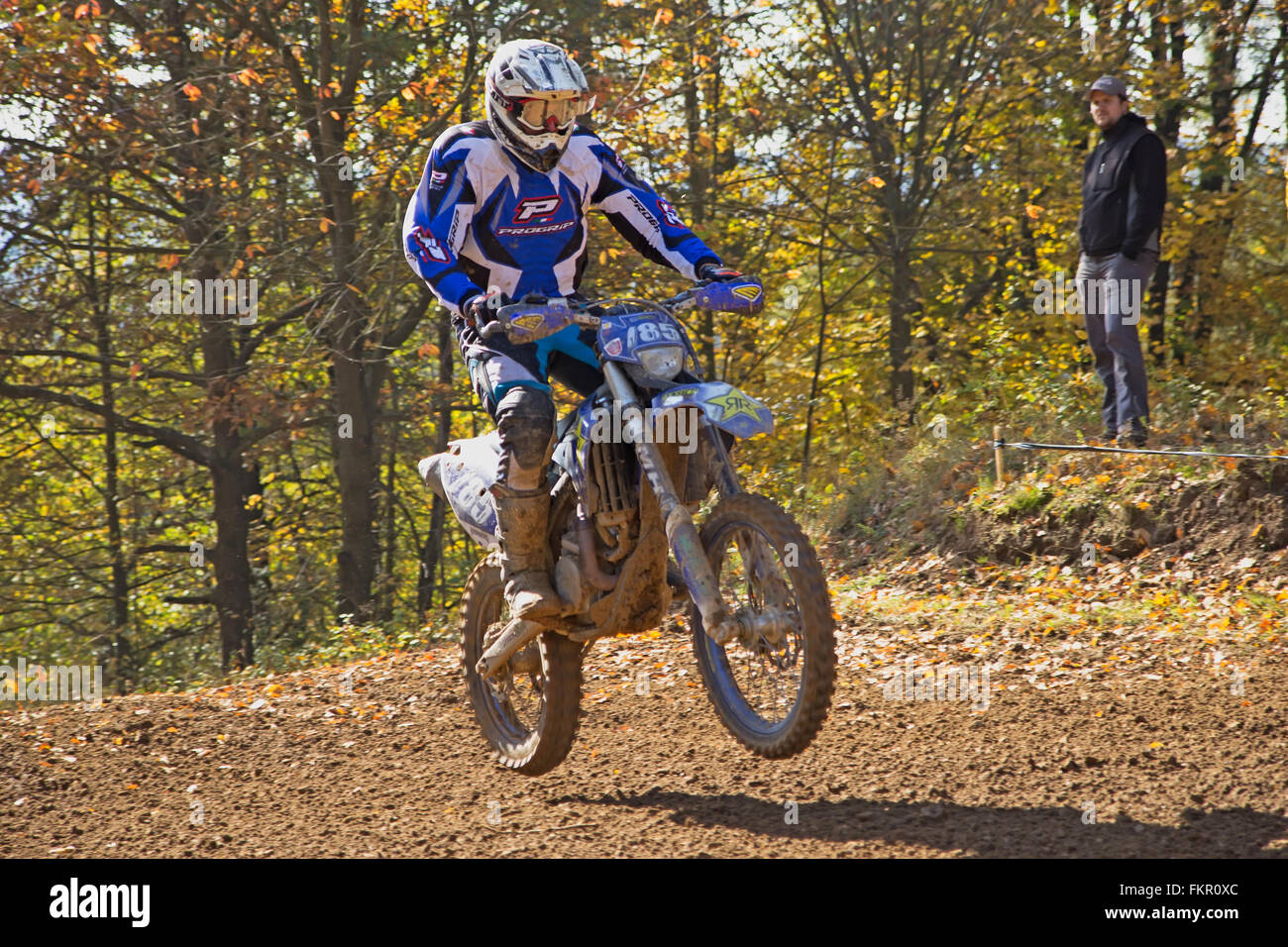 Motocross rider is jumping Stock Photo - Alamy