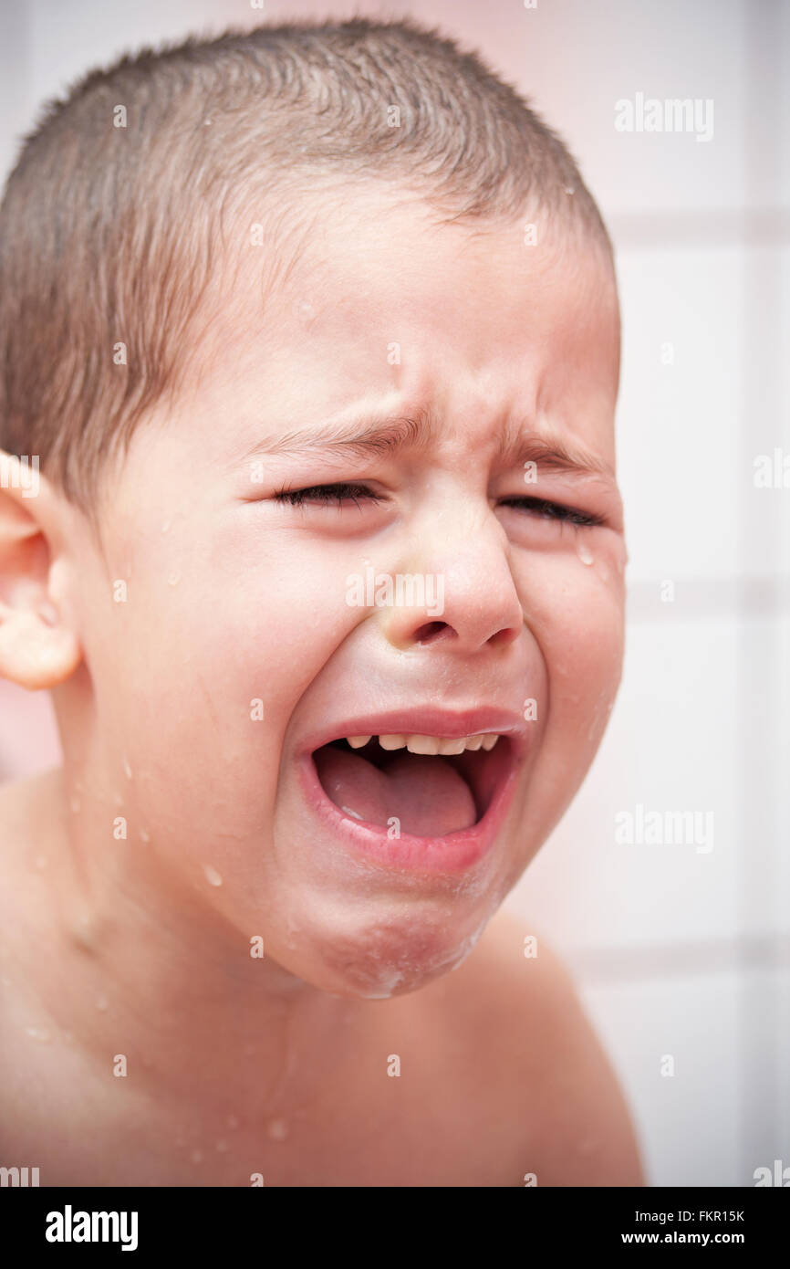 Closeup of a crying boy, studio shot Stock Photo - Alamy