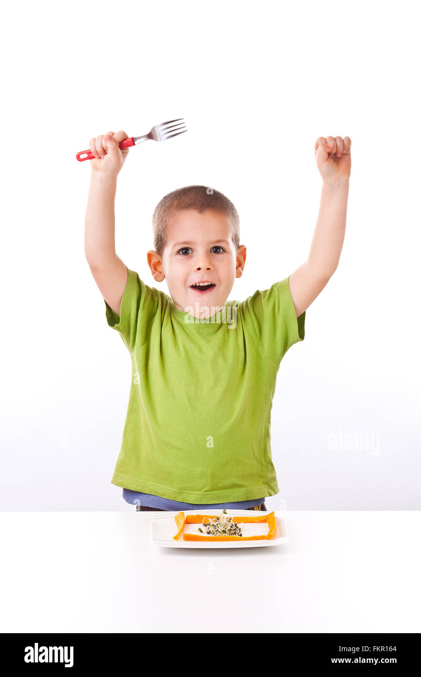 Happy boy with healthy salad Stock Photo - Alamy