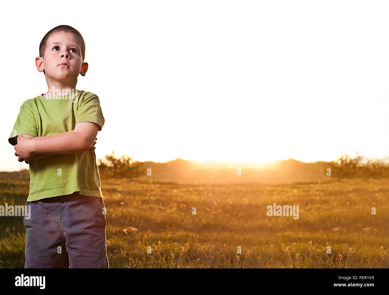 Portrait of a cute boy at sunset Stock Photo - Alamy