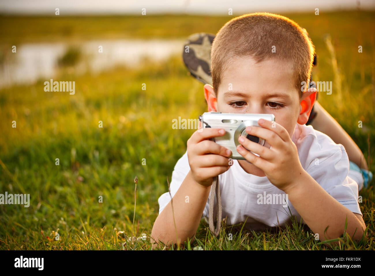 Little boy with the camera Stock Photo - Alamy