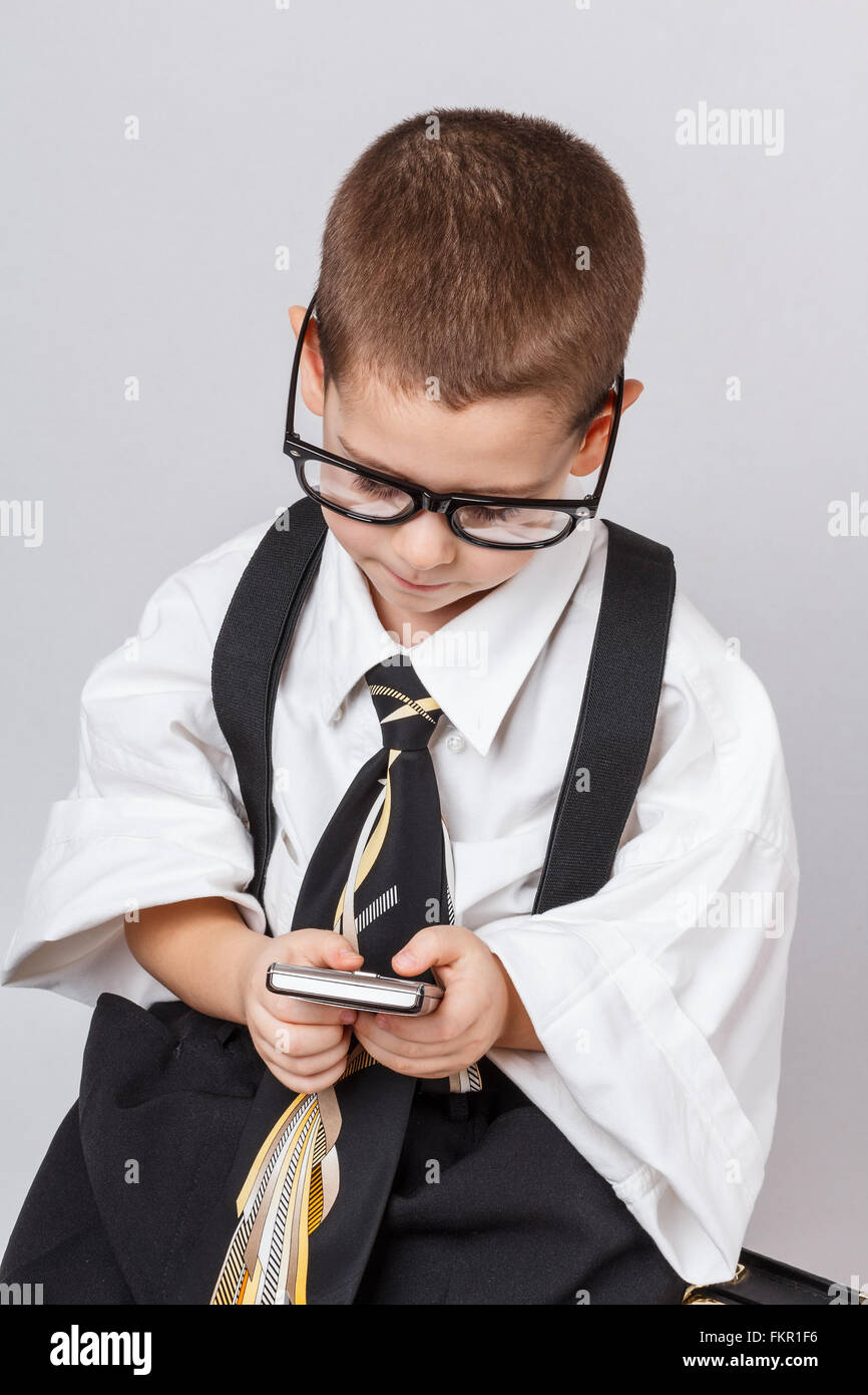 Little business man using mobile smart phone Stock Photo - Alamy