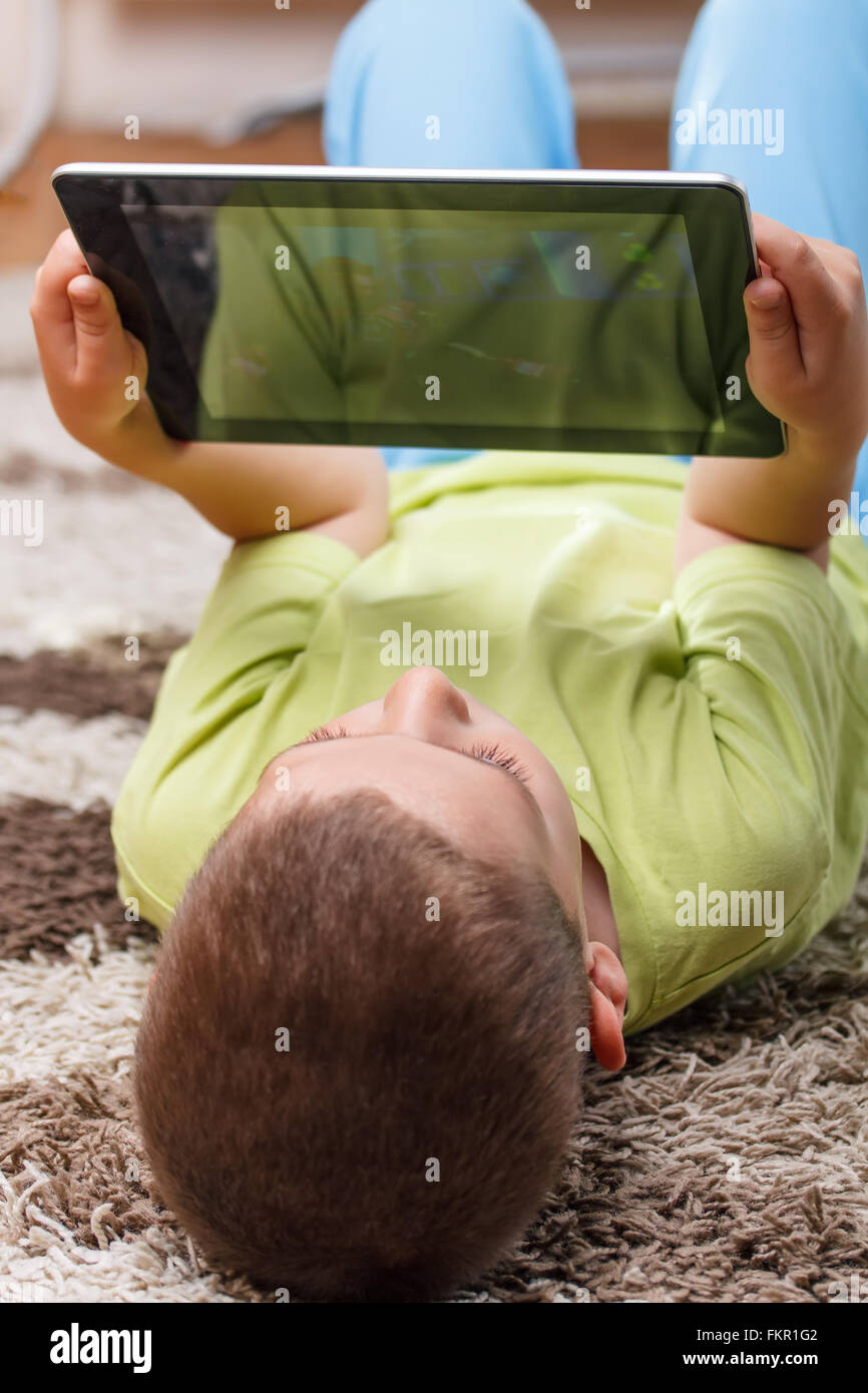 Little boy using tablet computer Stock Photo - Alamy