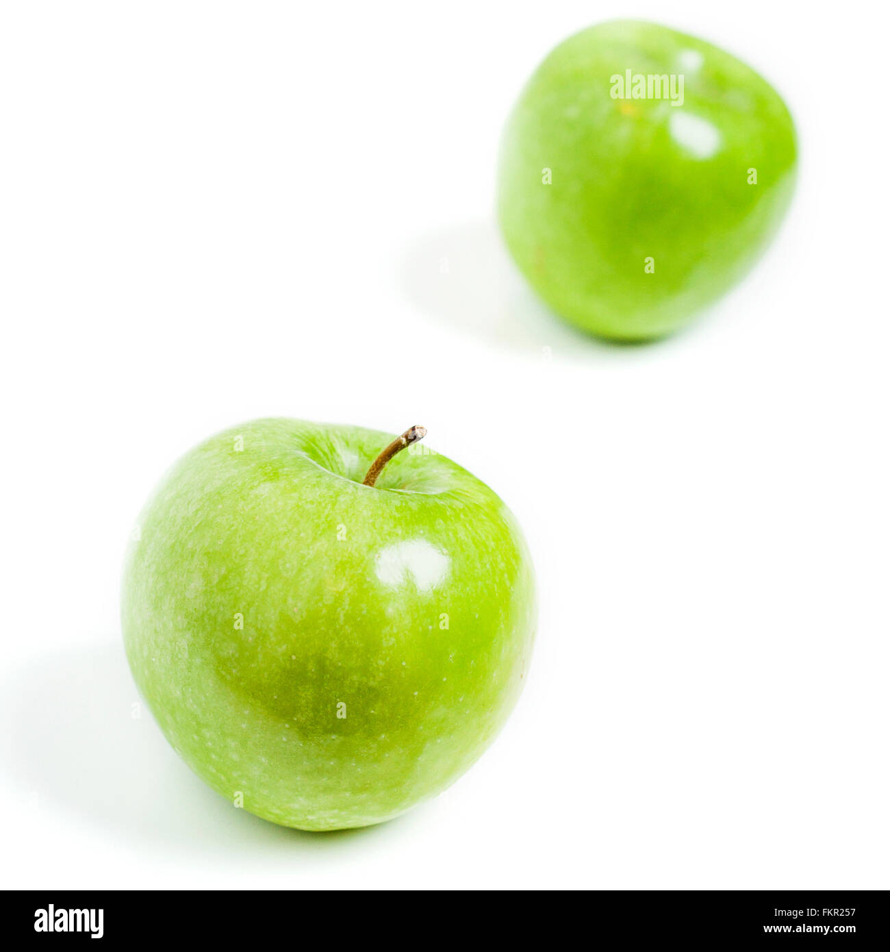 Green apples on background Cut Out Stock Images & Pictures - Alamy