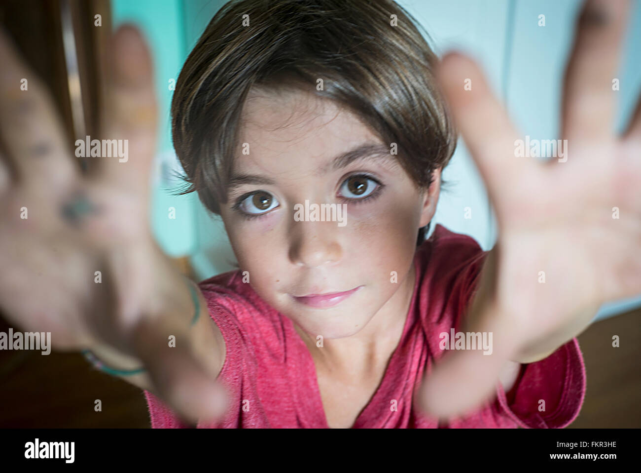 Caucasian boy reaching up Stock Photo - Alamy