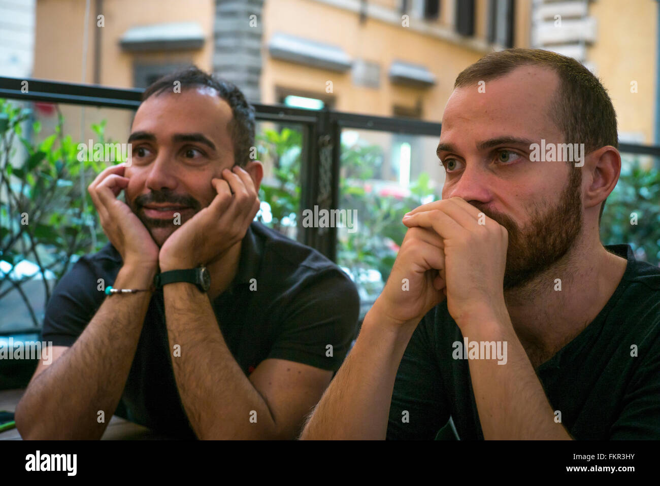 Caucasian men sitting in cafe Stock Photo - Alamy