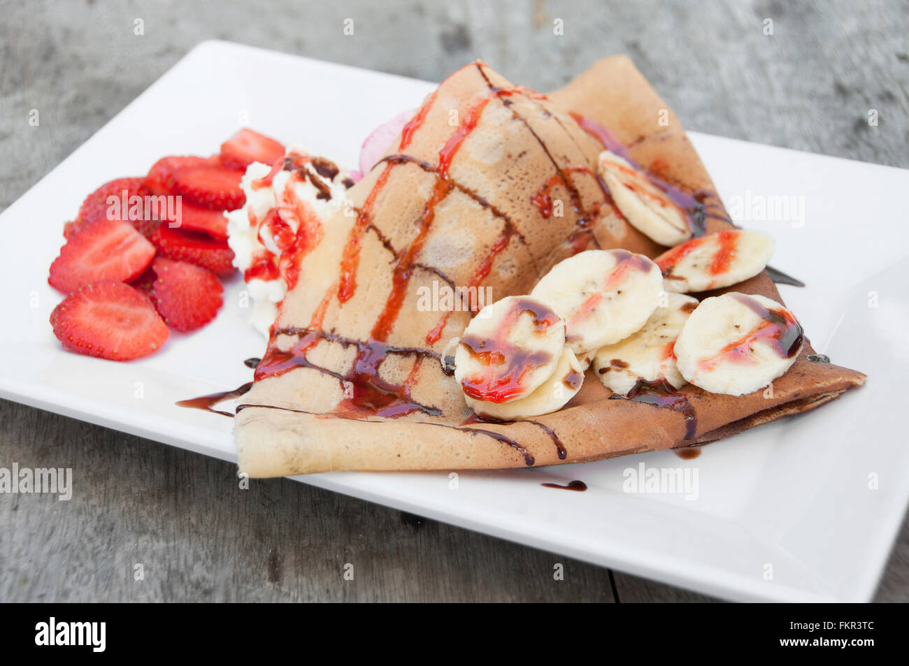Strawberry banana crape with ice cream Stock Photo - Alamy