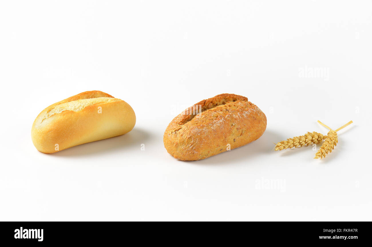 two freshly baked bread rolls on white background Stock Photo - Alamy