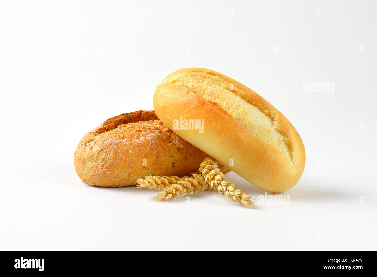two freshly baked bread rolls on white background Stock Photo - Alamy