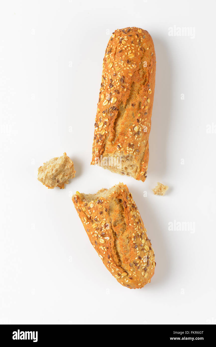 halved bread roll with seeds on white background Stock Photo - Alamy