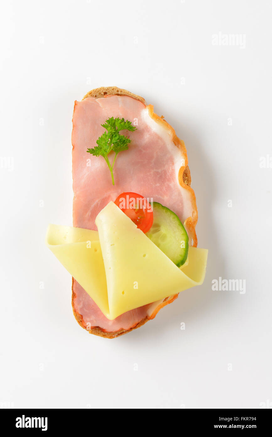 open faced sandwich with ham and cheese on white background Stock Photo ...