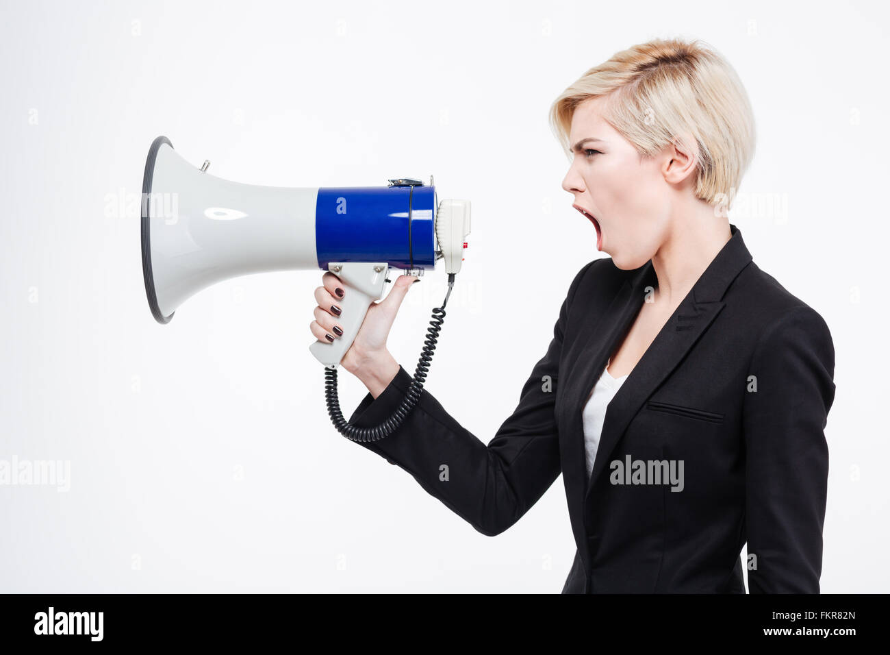 Businesswoman screaming into megaphone isolated on a white background ...