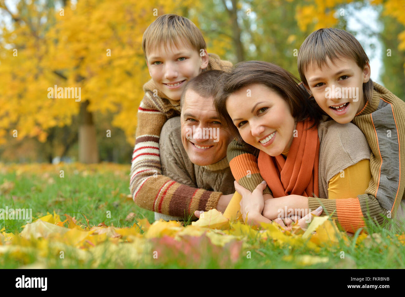 Portrait of family relaxing Stock Photo - Alamy