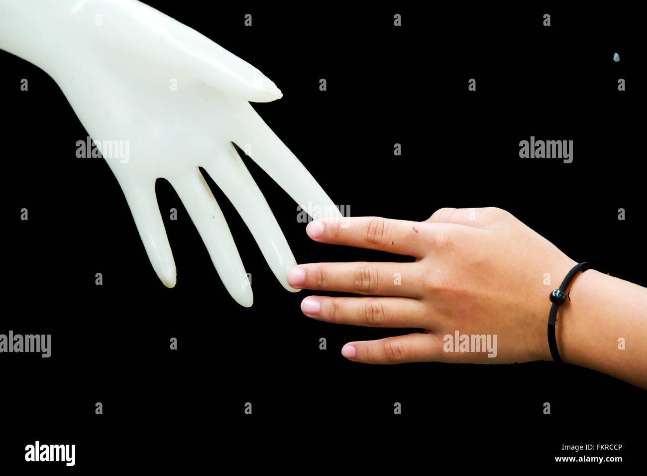 Relation concept : Human hand with plastic hand Stock Photo - Alamy
