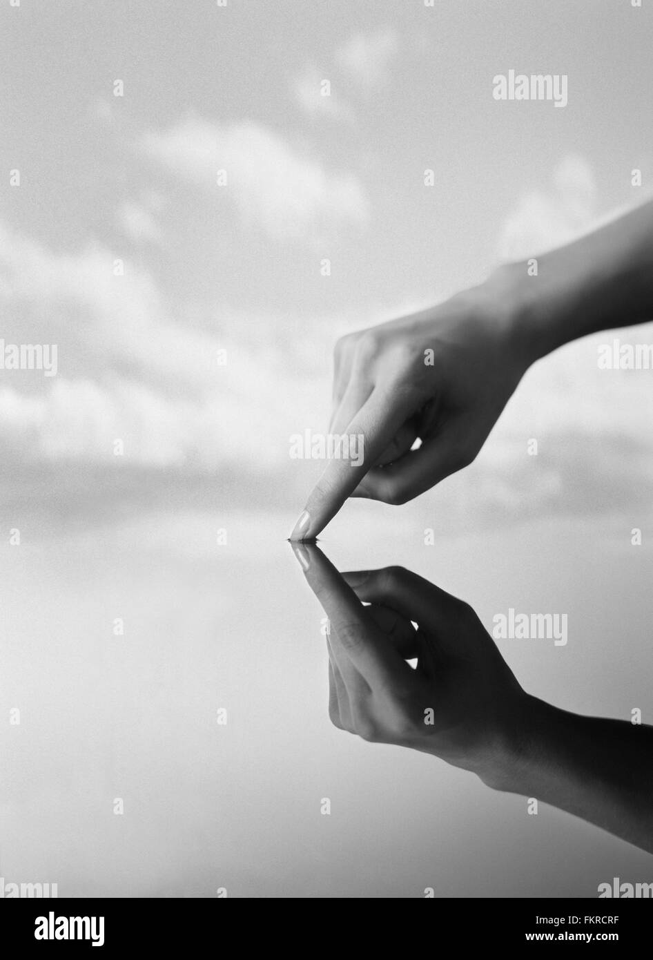 Touching hand Black and White Stock Photos & Images - Alamy